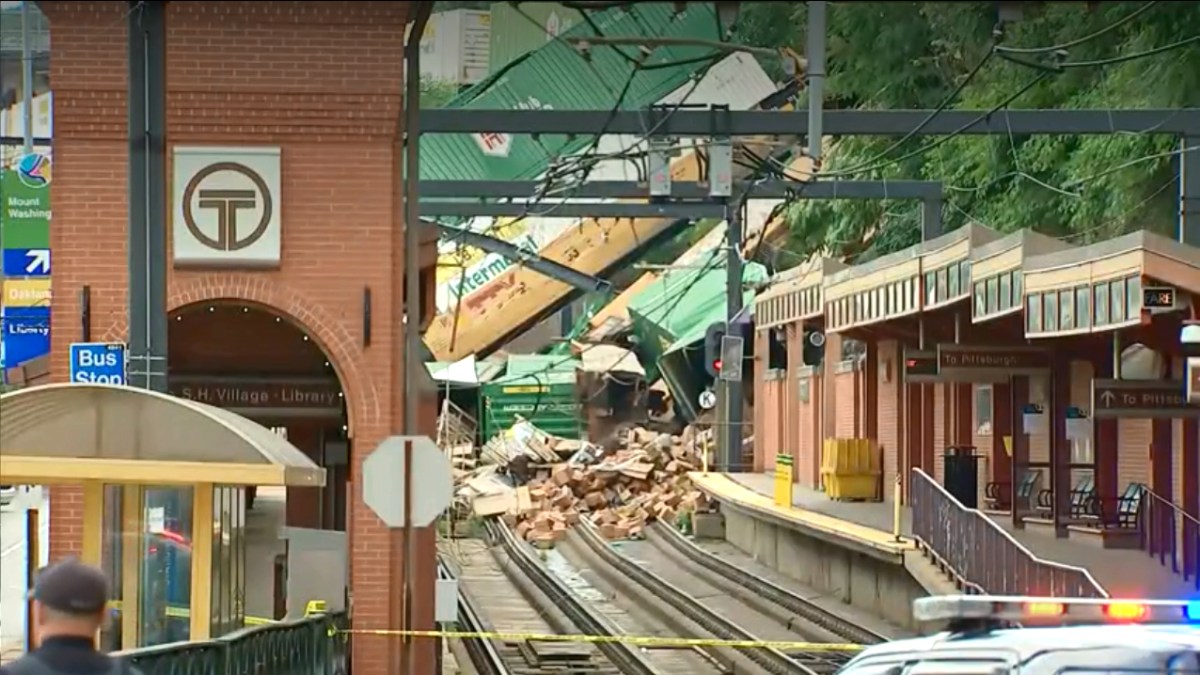 Freight Train Derails Sending Cars Tumbling Onto Light Rail Line in ...