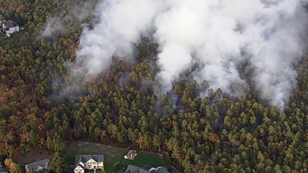 Large plumes of smoke in the air as crews battle forest fire in Evesham ...