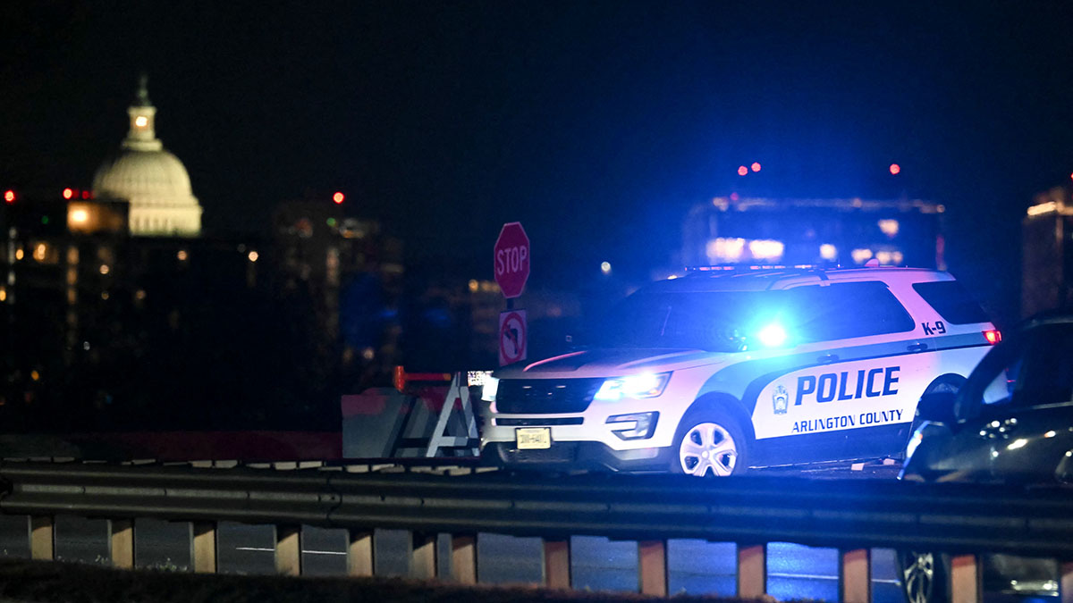 Photos: Massive response to crash of commercial jet, helicopter into ...