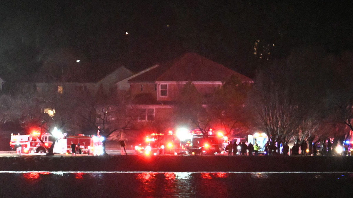 Photos: Massive response to crash of commercial jet, helicopter into ...