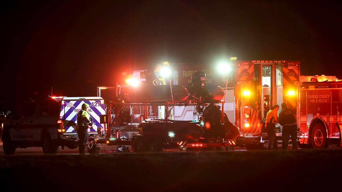Photos: Massive response to crash of commercial jet, helicopter into ...