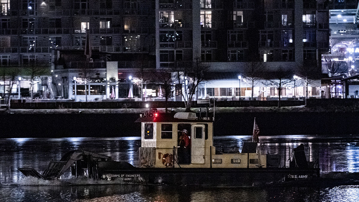 Photos: Massive response to crash of commercial jet, helicopter into ...