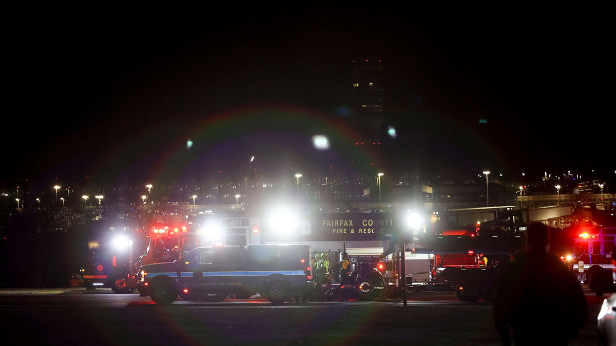 Photos: Massive response to crash of commercial jet, helicopter into ...