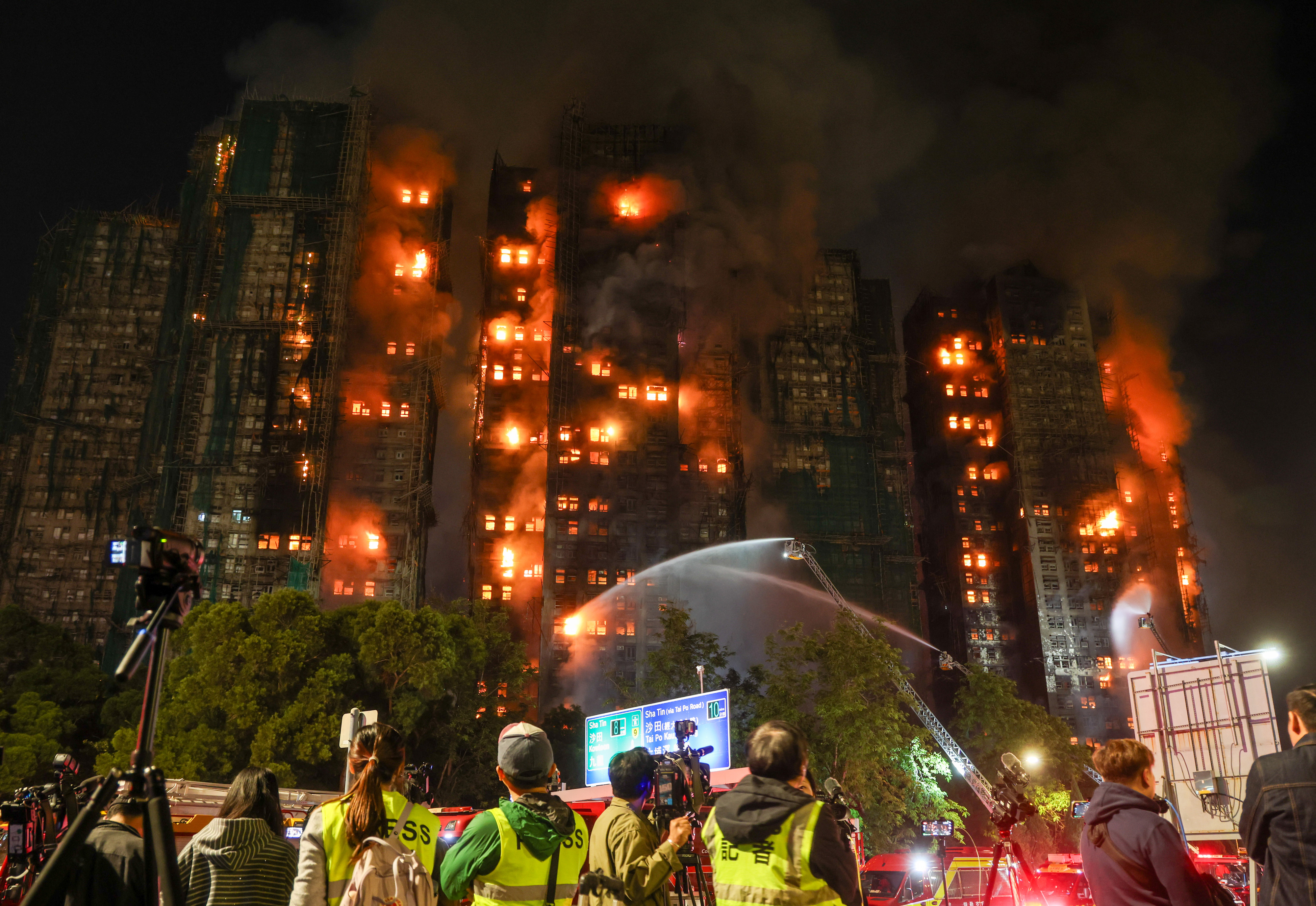 At least 94 dead as Hong Kong firefighters battle burning towers for a ...