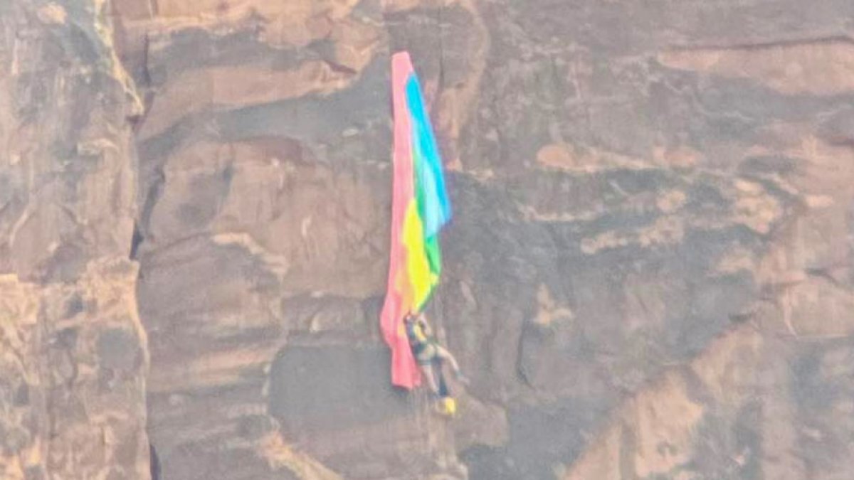 BASE jumper rescued after crashing into cliff and dangling from ...
