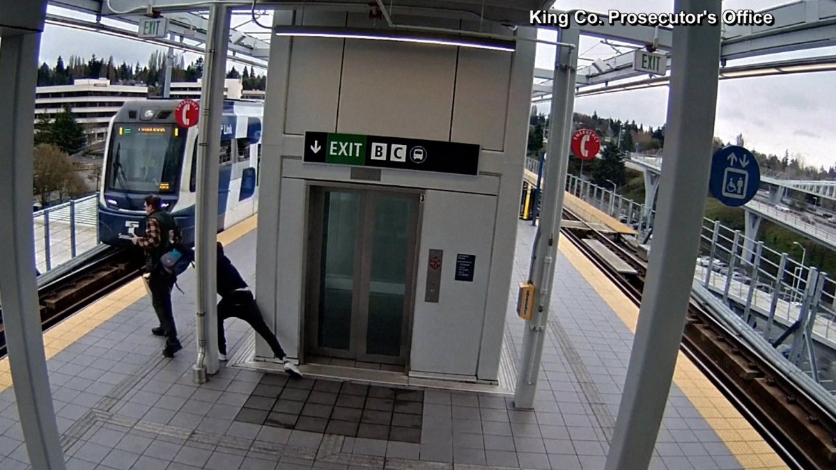 Watch as a man allegedly tries to push a person in front of a train in ...